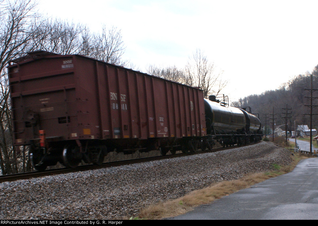 671 - buffer car on the rear of the first oil train, K08005, en route ...