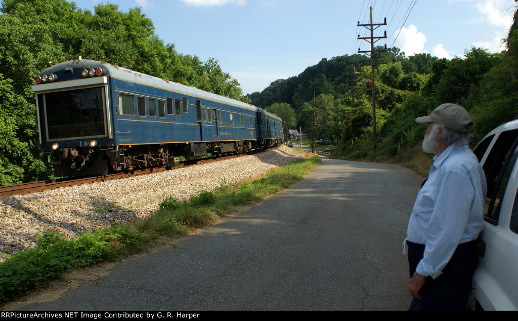 Regular train watcher at Reusens watches the W001 geometry train sail ...