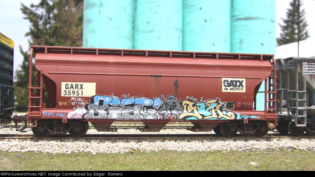 GARX 35951. Custom vandalized Atlas Trainman covered hopper