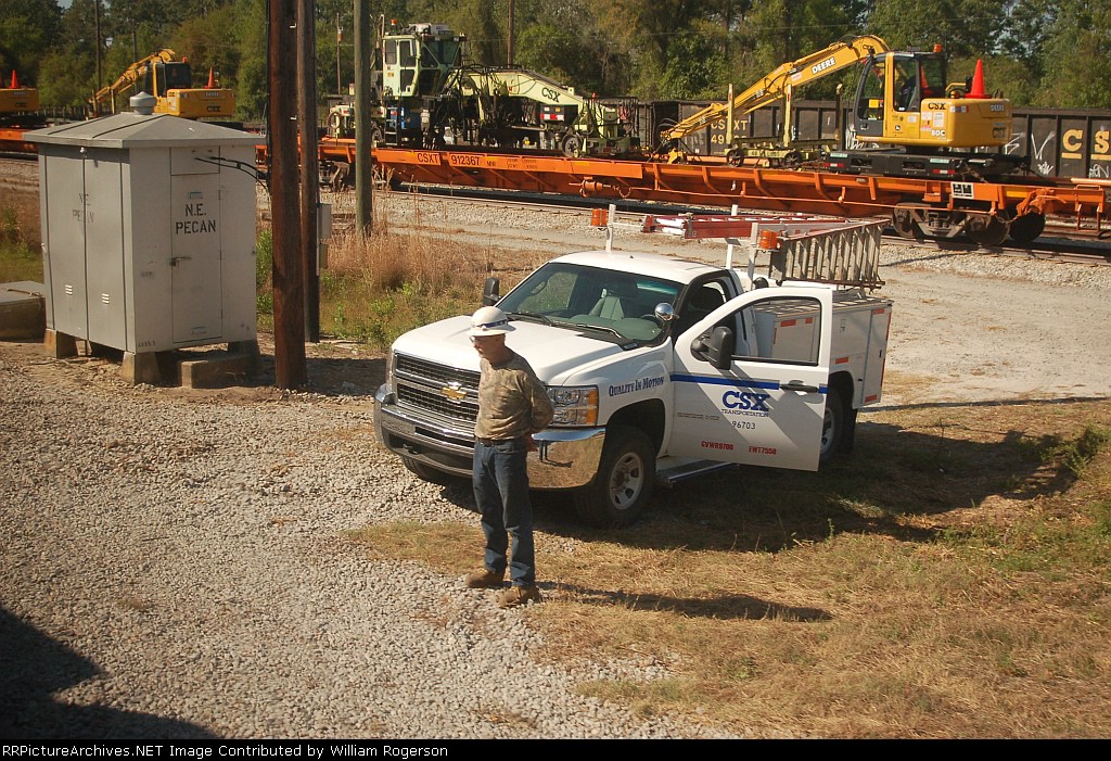 CSX Transportation (CSX) Employee inspects Train - CSX Vehicle No. 96703