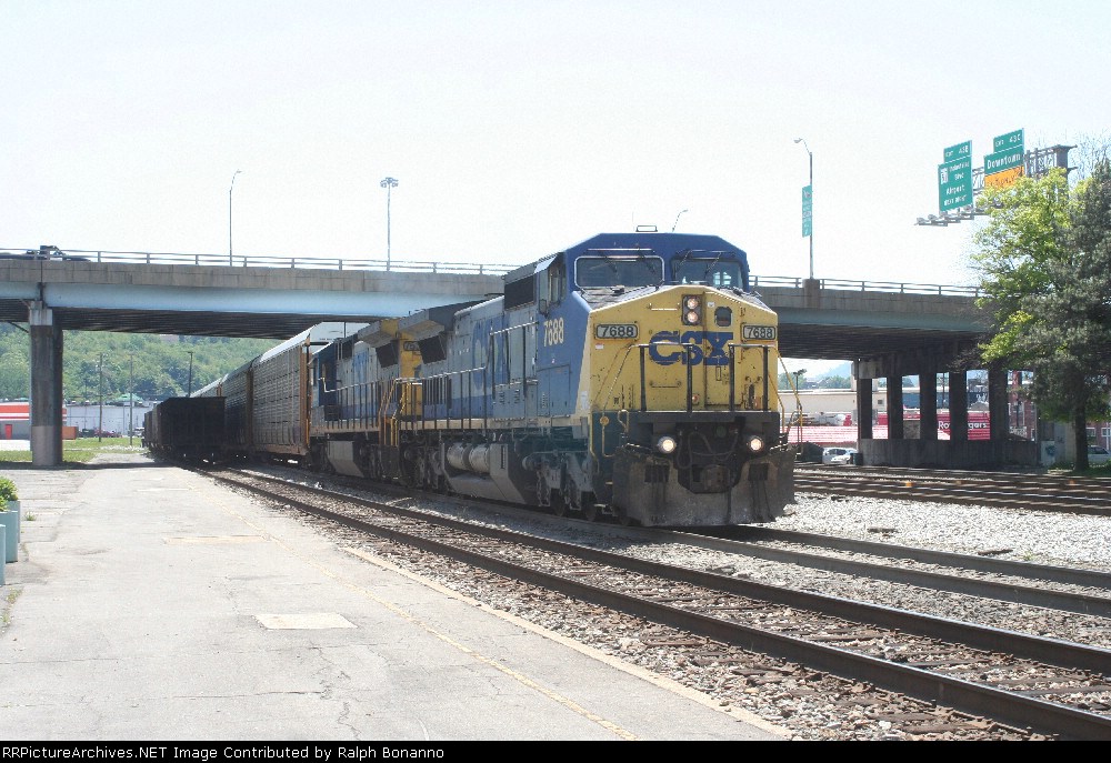 Q217, after getting recrewed, departs west, passing the Amtrak station
