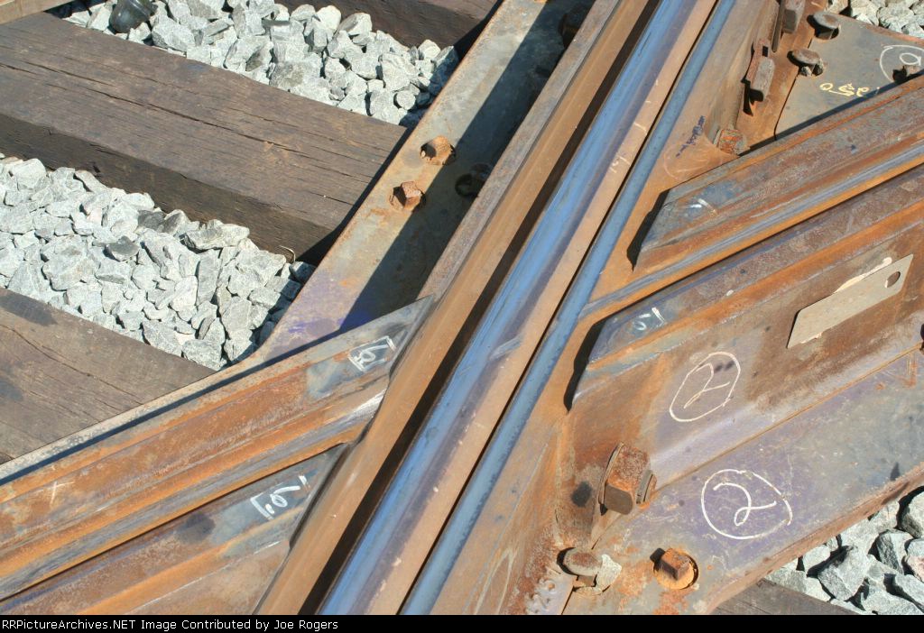 Low speed trains pass over top of higher speed, higher density main track