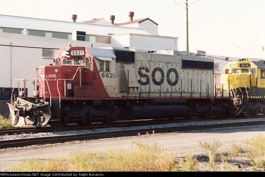 A SOO SD40-2 and an NYSW SD45 rest in the late afternoon sun on the ...