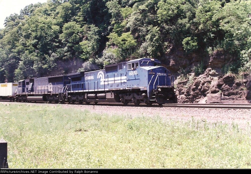 Eastbound van train rolls east in heavy dynamics as it rounds the ...