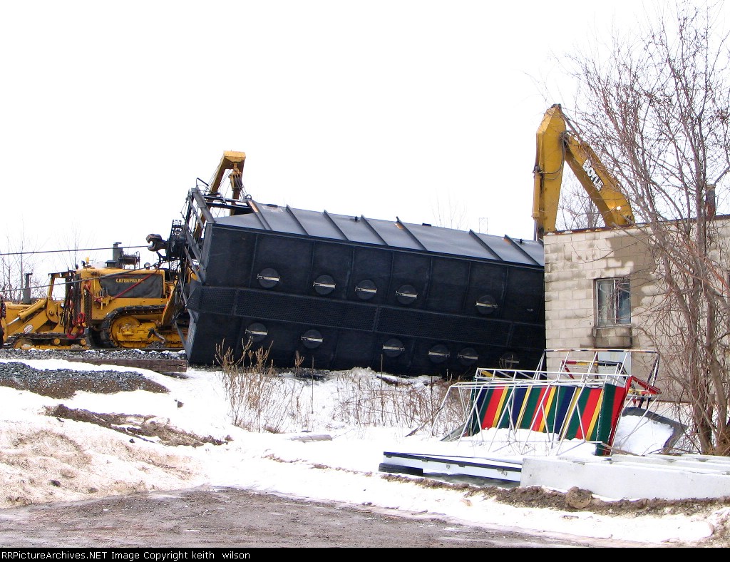 Car flipped over and hit building