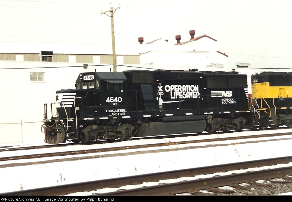 This Specially painted GP59 sits on the fuel track with an SD70M ...