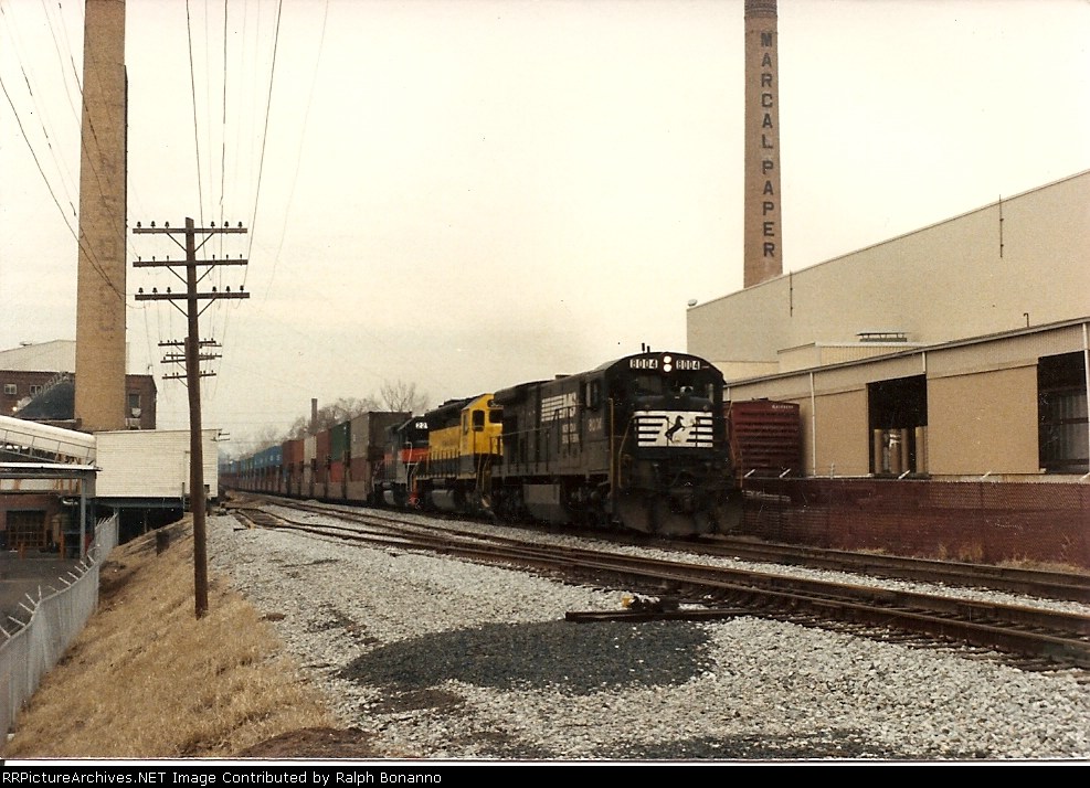 An eastbound hanjin train passes the Marcal paper factory with a trio ...