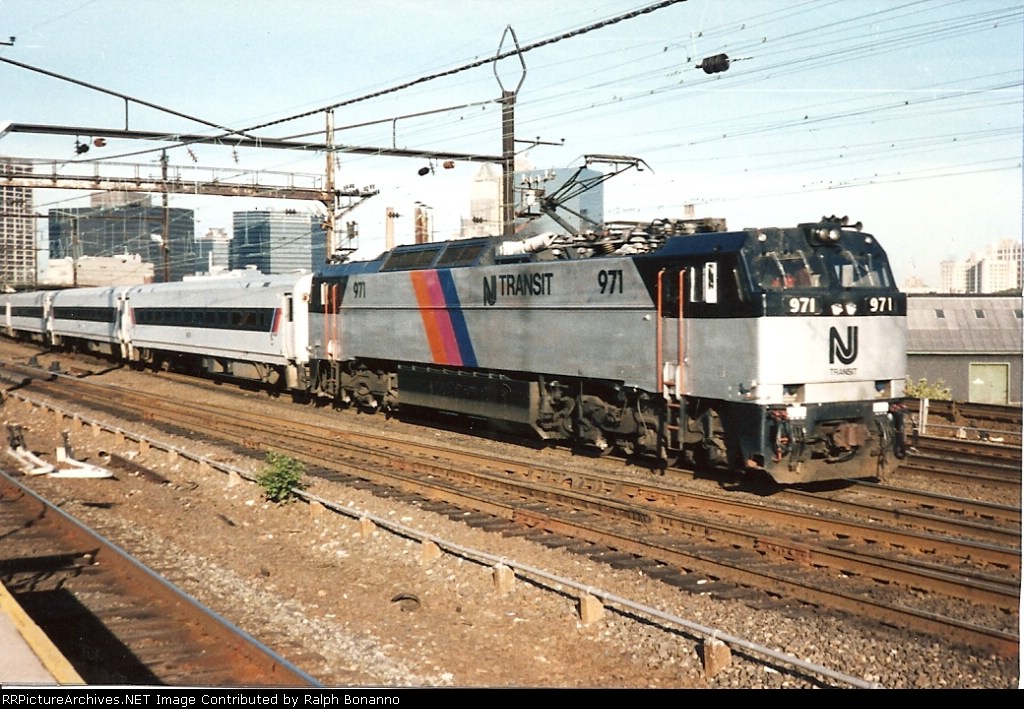 A former Amtrak E60 leads this train eastbound towards New York City