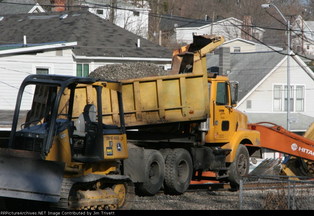 NS dump truck unloading limestone as part of bridge replacment project
