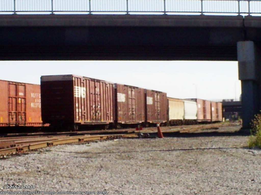 NS boxcars, covered hoppers and NS 3393 waiting in the distance