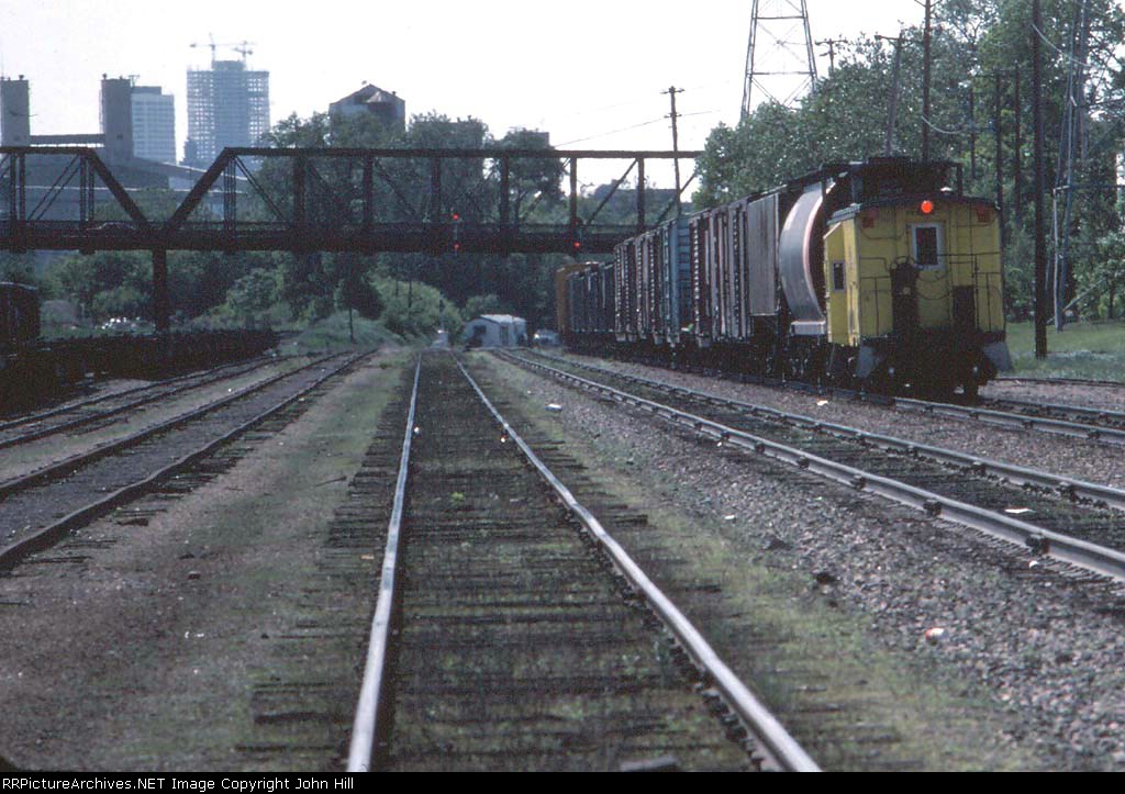 1232-37 Eastbound C&NW freight approaches BN ex-GN Saint Anthony Junction