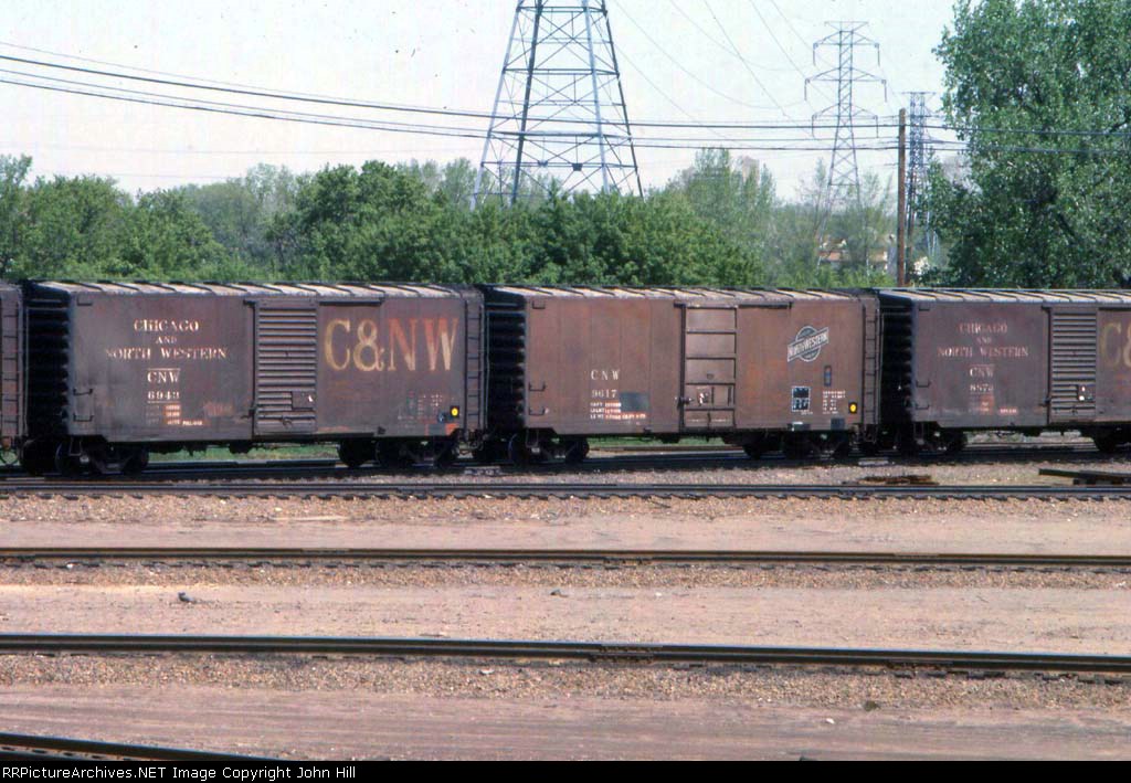 1162-17 Eastbound C&NW freight on BN ex-GN#passes north of GN Depot