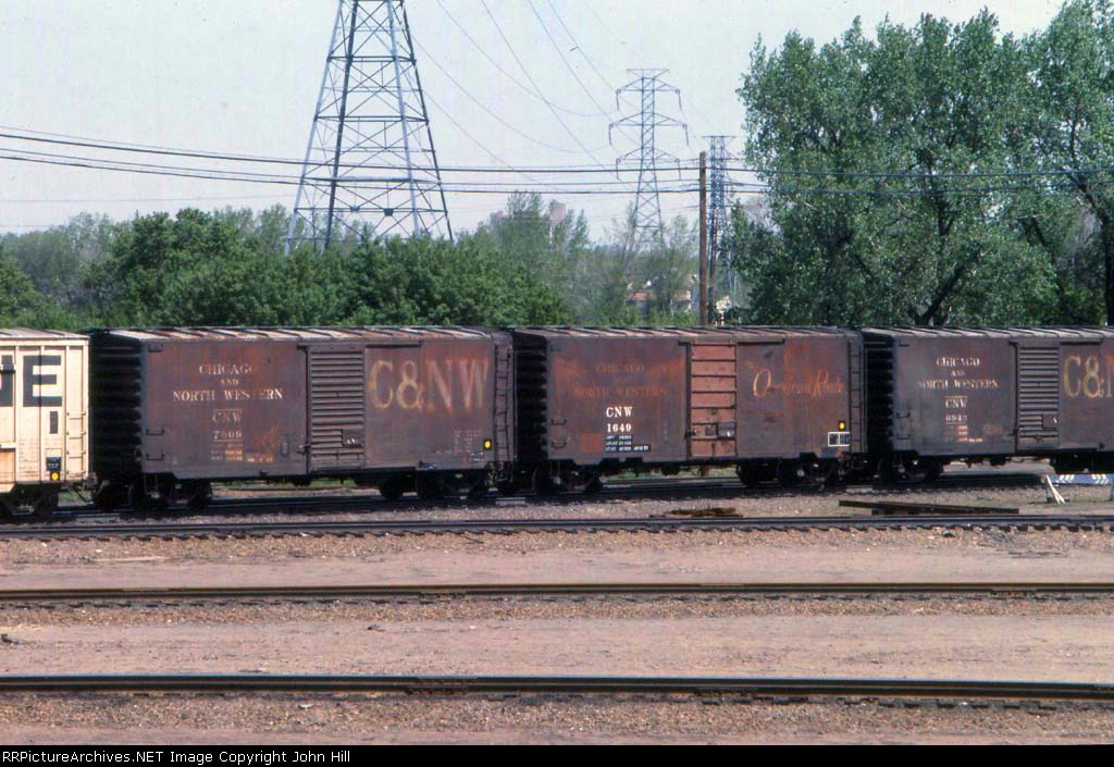 1162-19 Eastbound C&NW freight on BN ex-GN passes north of GN Depot