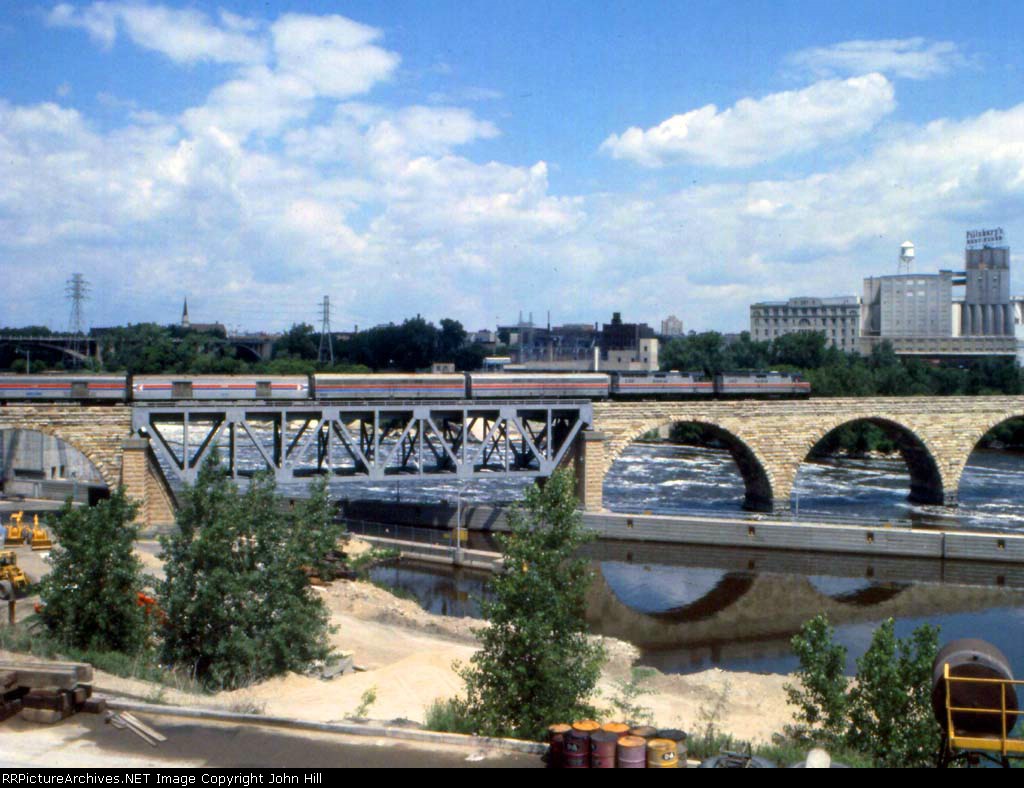 1172-15 Eastbound Amtrak North Coast Hiawatha crossing Stone Arch Bridge