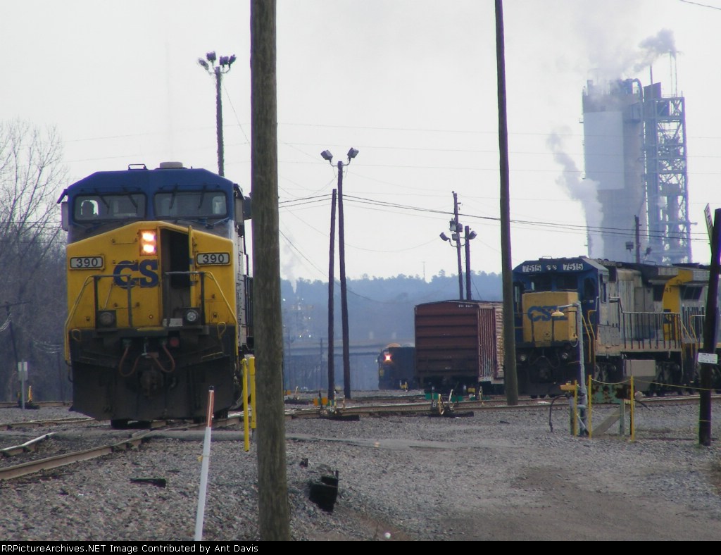 CSX 390 (power for F783) backs up towards its train while power for ...