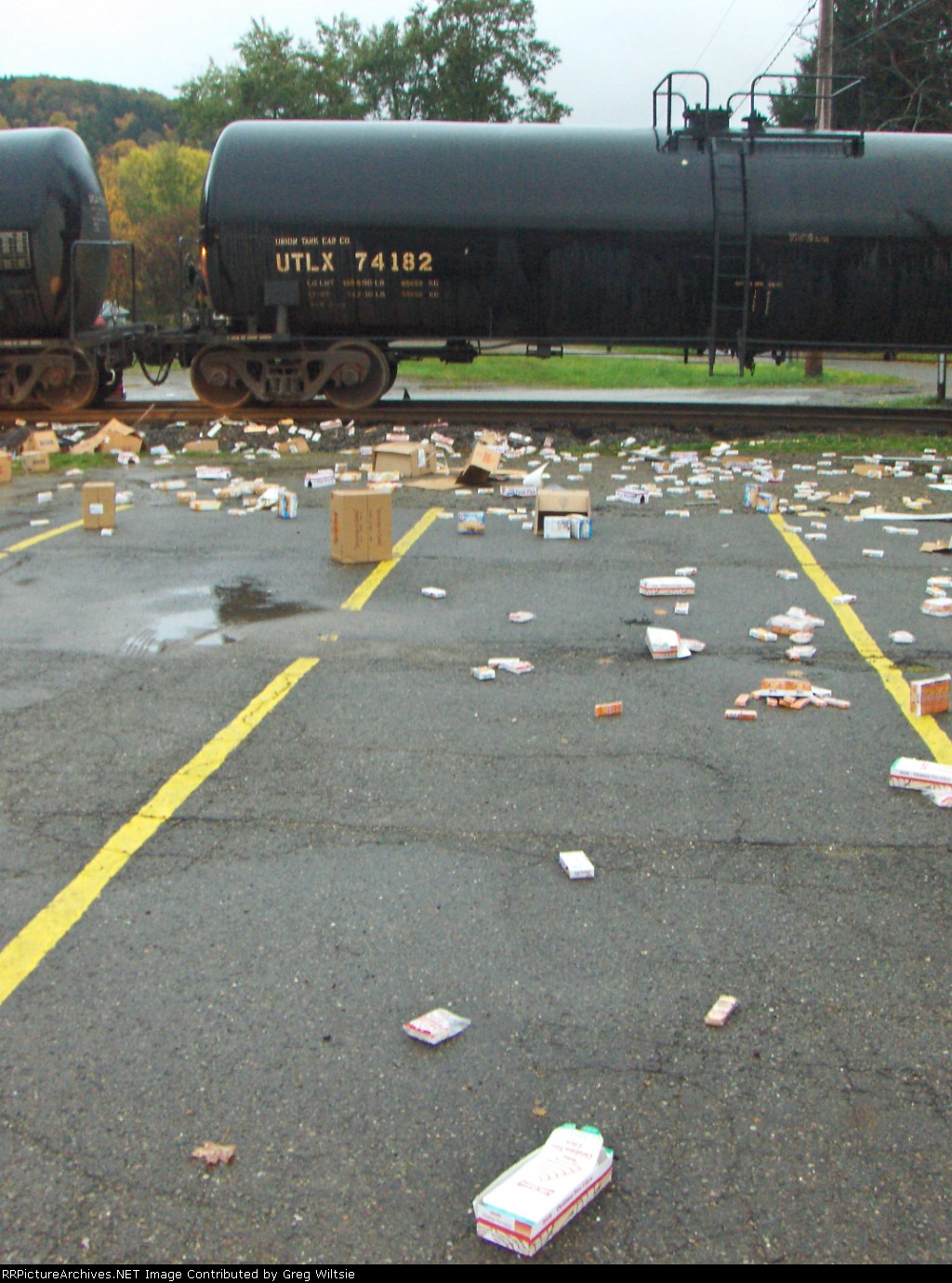 Scattered Little Debbie snack cakes after trailer hit by train