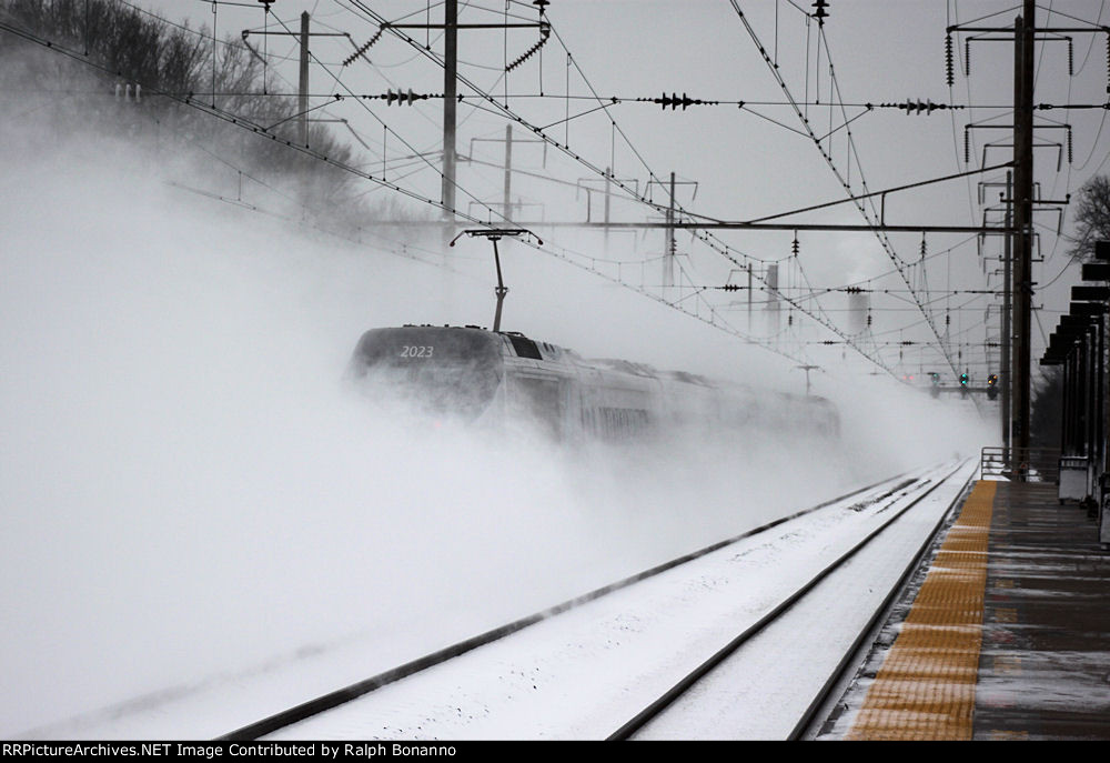 Westbound ACELA gets buried in the snow from a passing eastbound ...