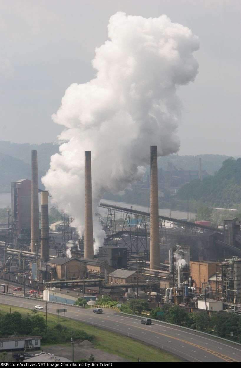 Steam billows into the air as a charge of coke is quenched in a ...