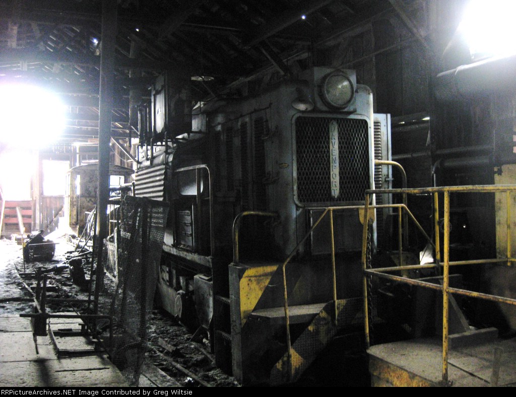 An old industrial engine sits in the shops area