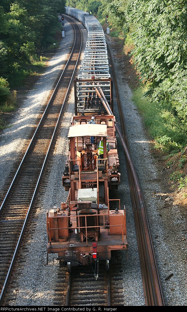 71 - NS rail train 912 pulls forward depositing another pair of lengths ...