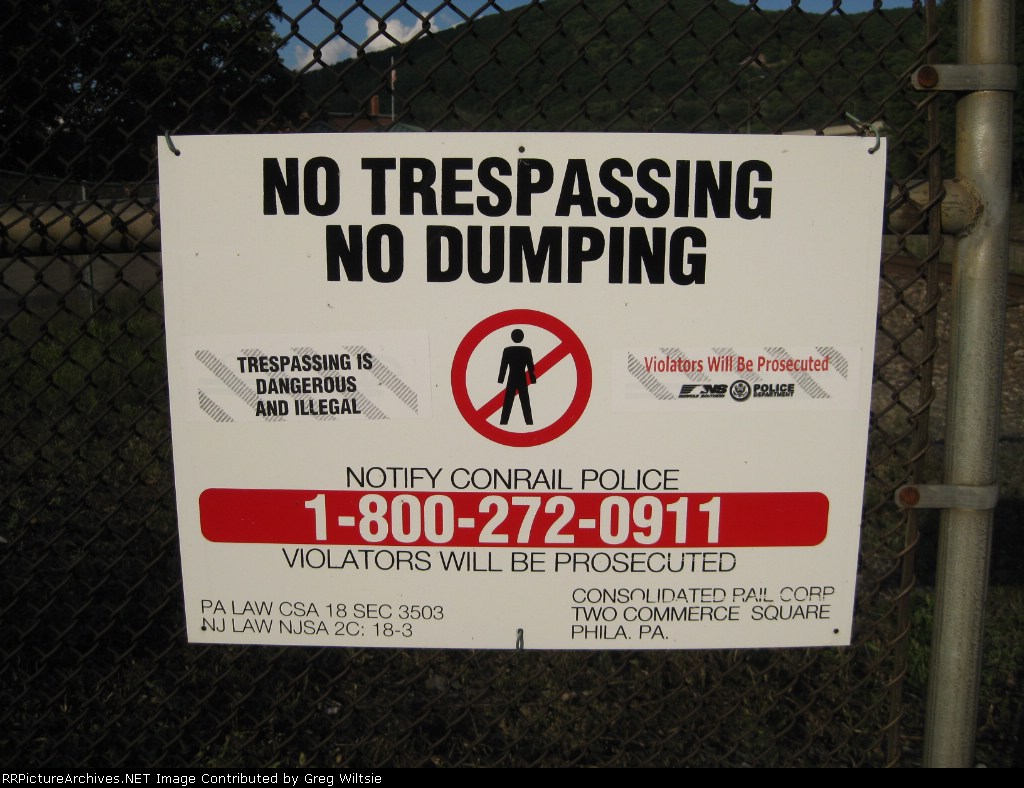 A Conrail and Norfolk Southern police No Trespassing sign