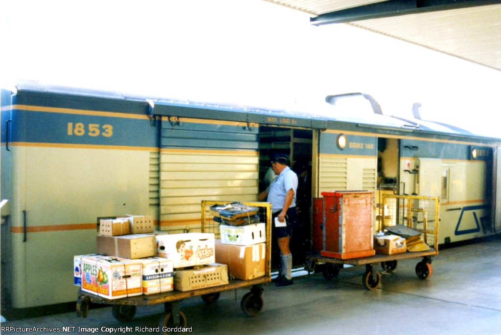 Loadinh the baggage car of the Midlander