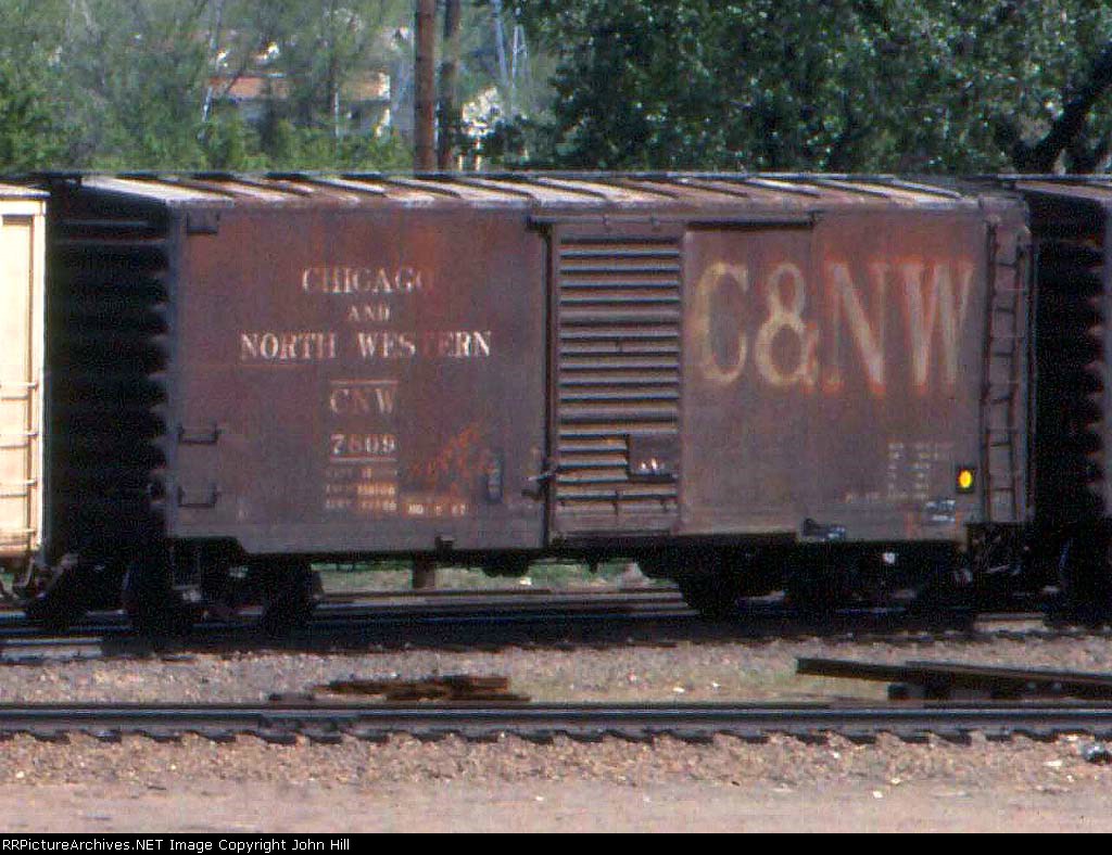 1162-20b CNW 7809 on eastbound freight passing Mpls GN Depot