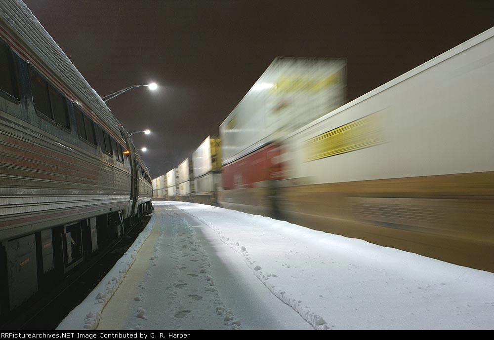 NS train 214's containers are a blur as they pass the parked Lynchburg ...