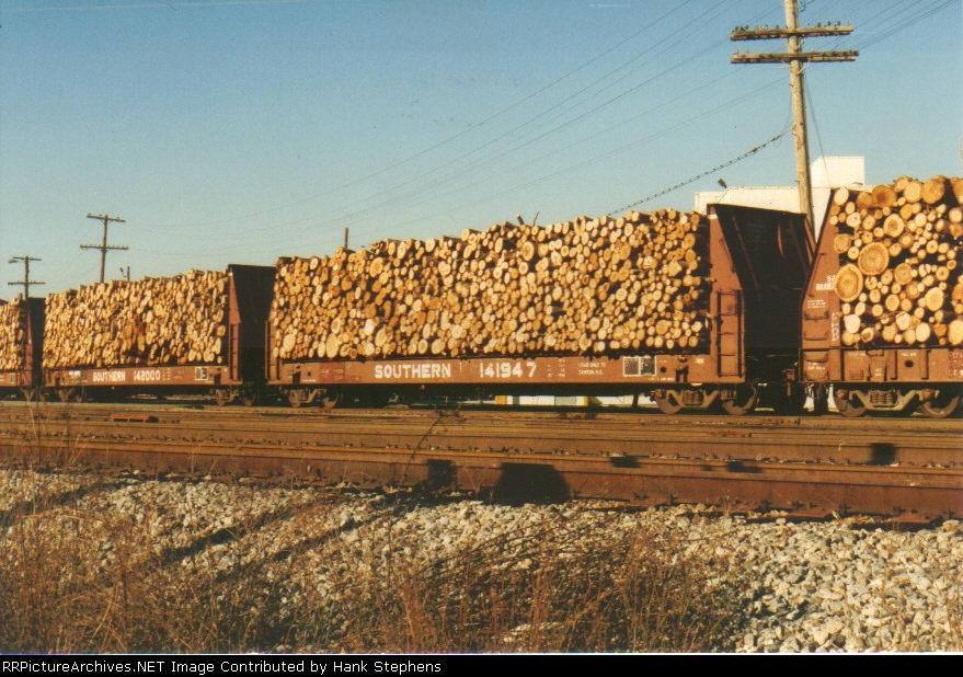 NS 141947 makes up a cut of loaded pulpwood cars on their way to the ...