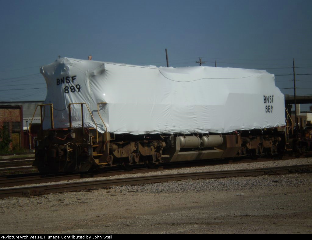 Shrink wrapped locomotive at 8th Street