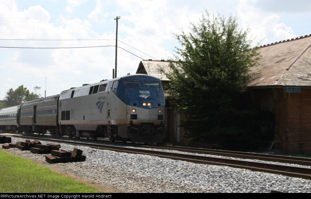 AMTK 90 leads train 90 past the abandoned Elm City station