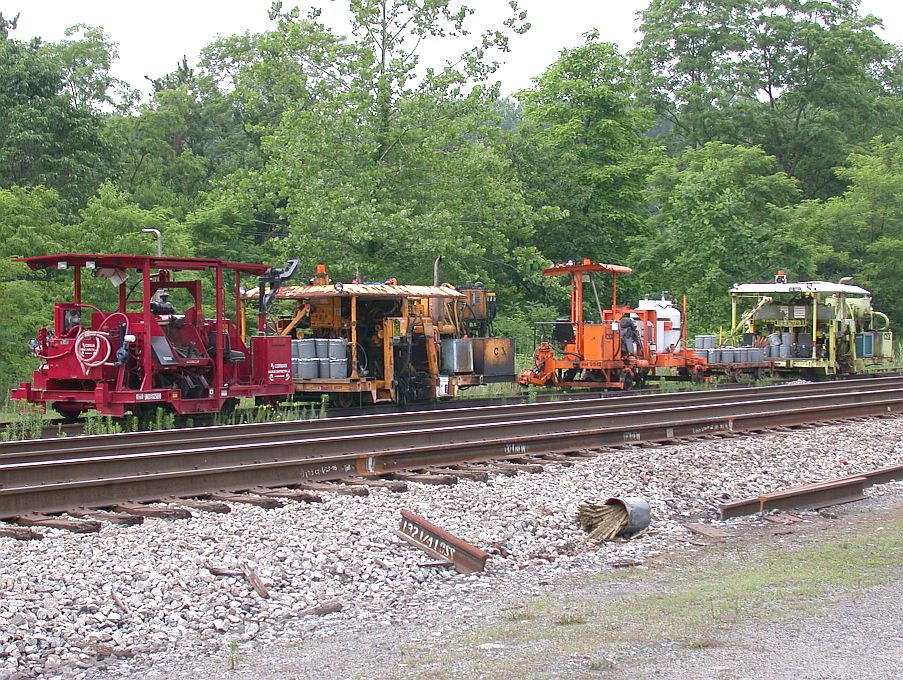 Colorful MOW consist by the depot