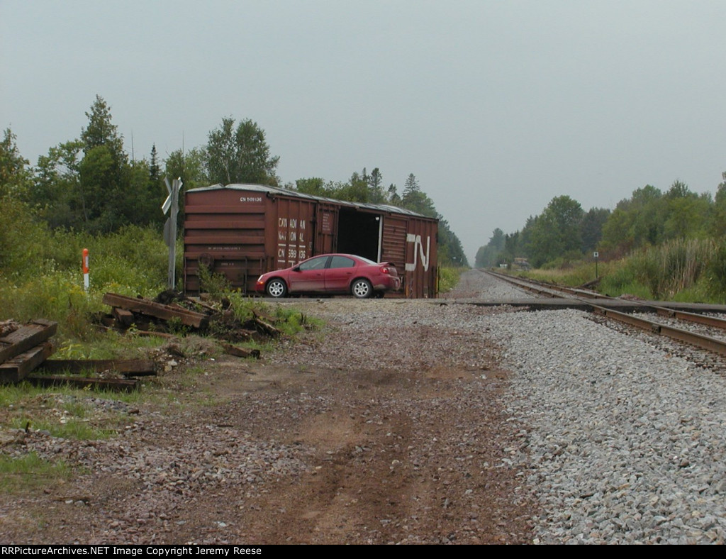 Box Car derailed by Whites Grocery west of Escanaba