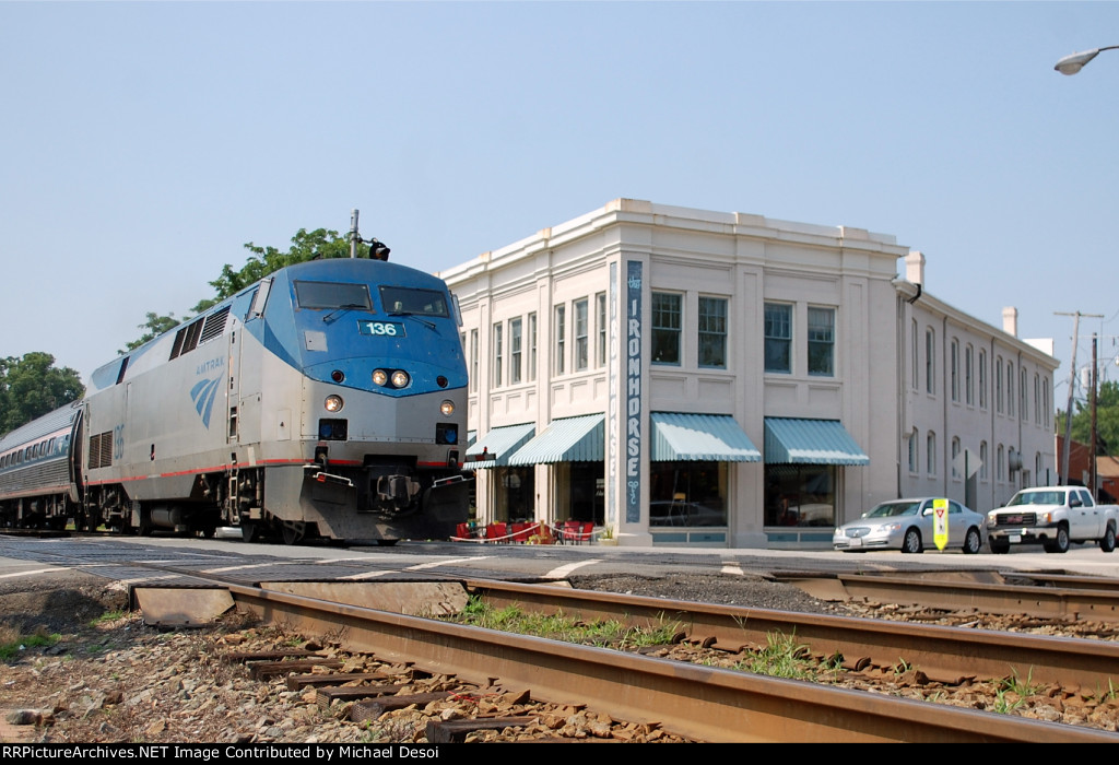 Amtk P-42DC #136 leads a northbound past "The Ironhorsse"