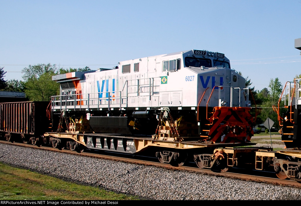VLI BB40-9WM #6027 is one of 8 locomotives in this train heading east ...