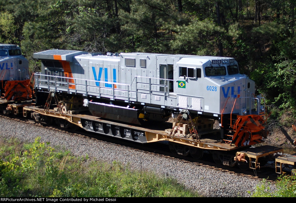VLI BB40-9WM #6028 is one of 8 locomotives in this train heading east ...