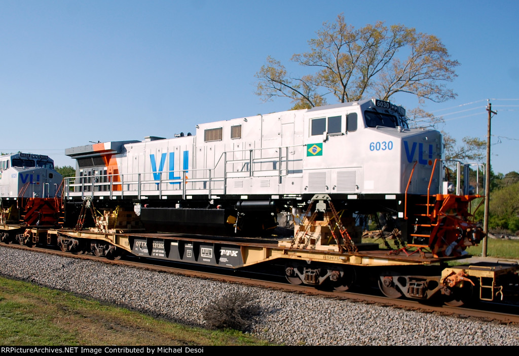 VLI BB40-9WM #6030 is one of 8 locomotives in this train heading east ...