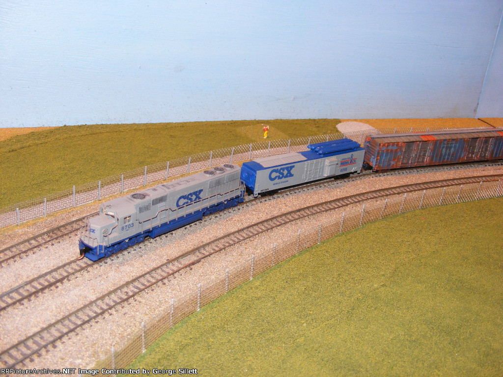 A kato CSX YN1 SD60 powers a refer train around the layout.