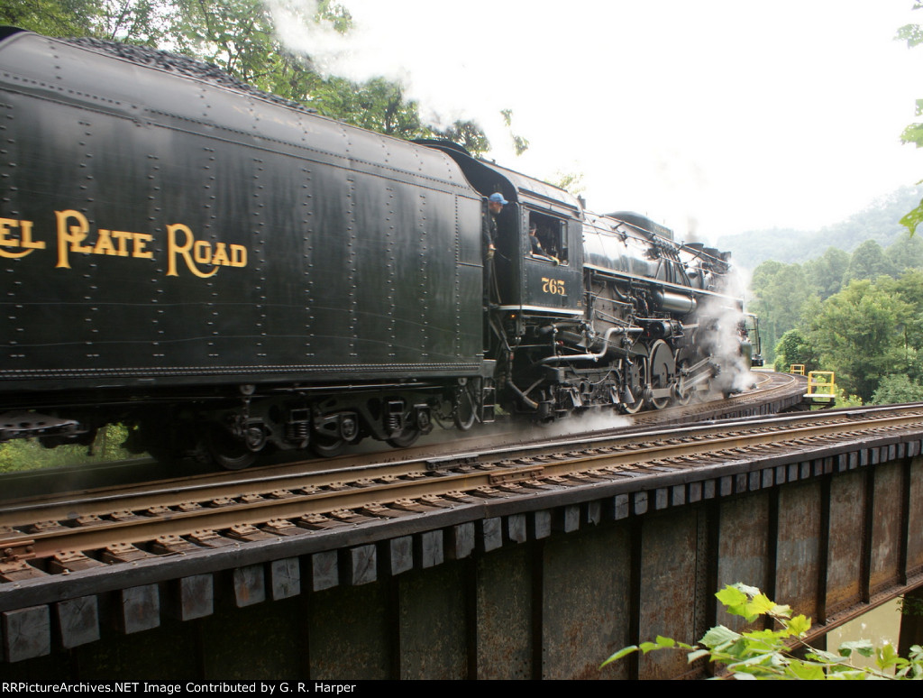 NKP 765 negotiates the west leg of the wye at Devon as it starts its ...