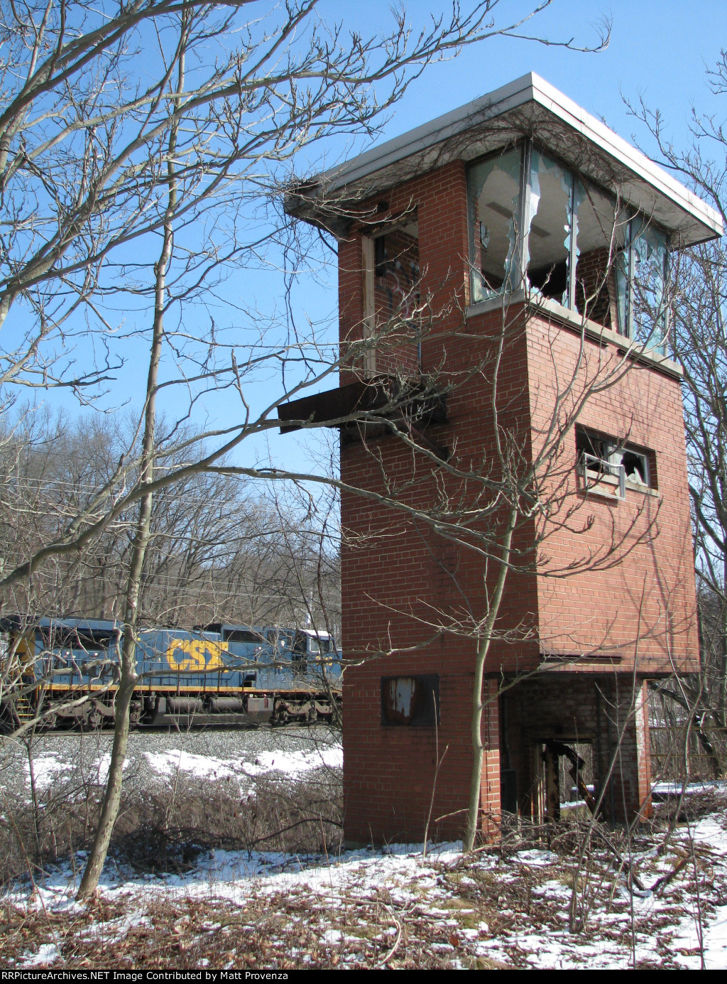 P&LE Abandoned Yard tower with CSX freight passing by