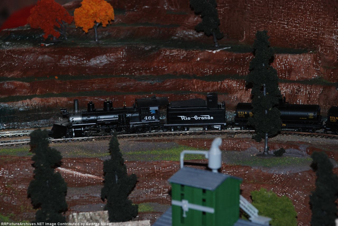 A narrow guage 2-8-2 heads over the mountain.