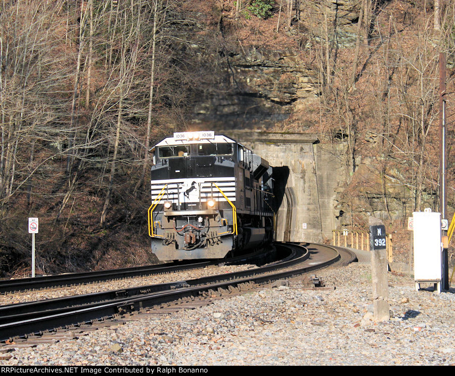 Eastbound coal drag train symbol #578 emerges into the morning sun from ...