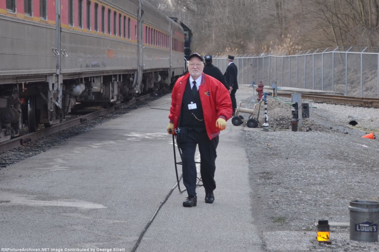 Moving the hose down.