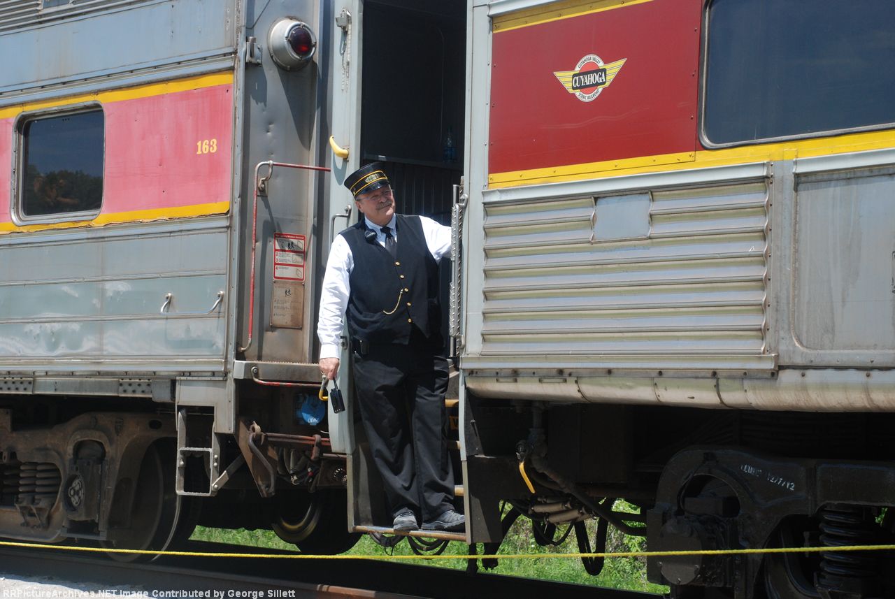 Conductor Tom makes sure his train is stopped at just the right spot...