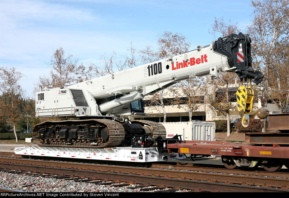 Dymax Rail Tow Railer 90T with HZGX cars on work train.