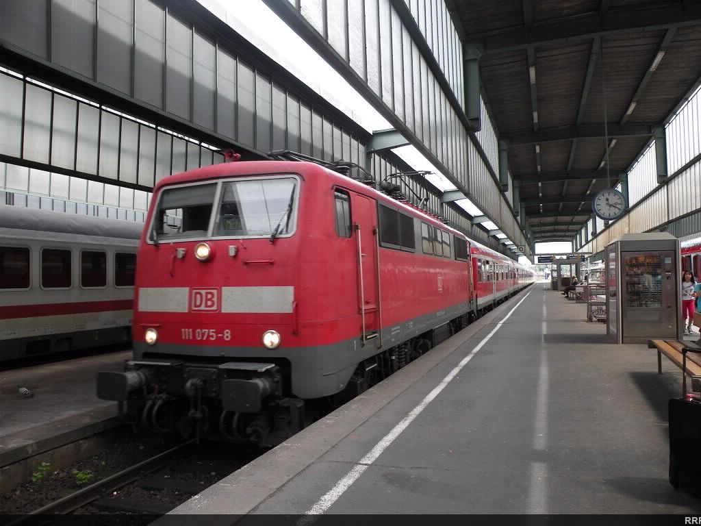 A DB Class 111 pulls into Stuttgart with a local passenger train.