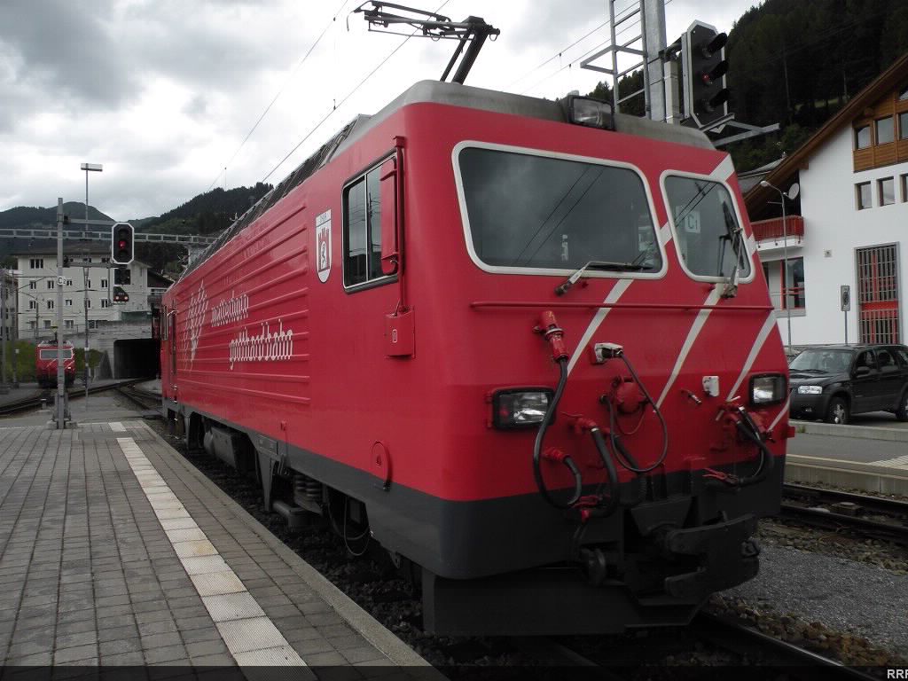 Rack (cog) equipped Hge 4/4 II of the MGB backing onto the Glacier Express.