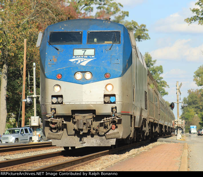 Southbound Amtrak train 89 rolls through town behind #7
