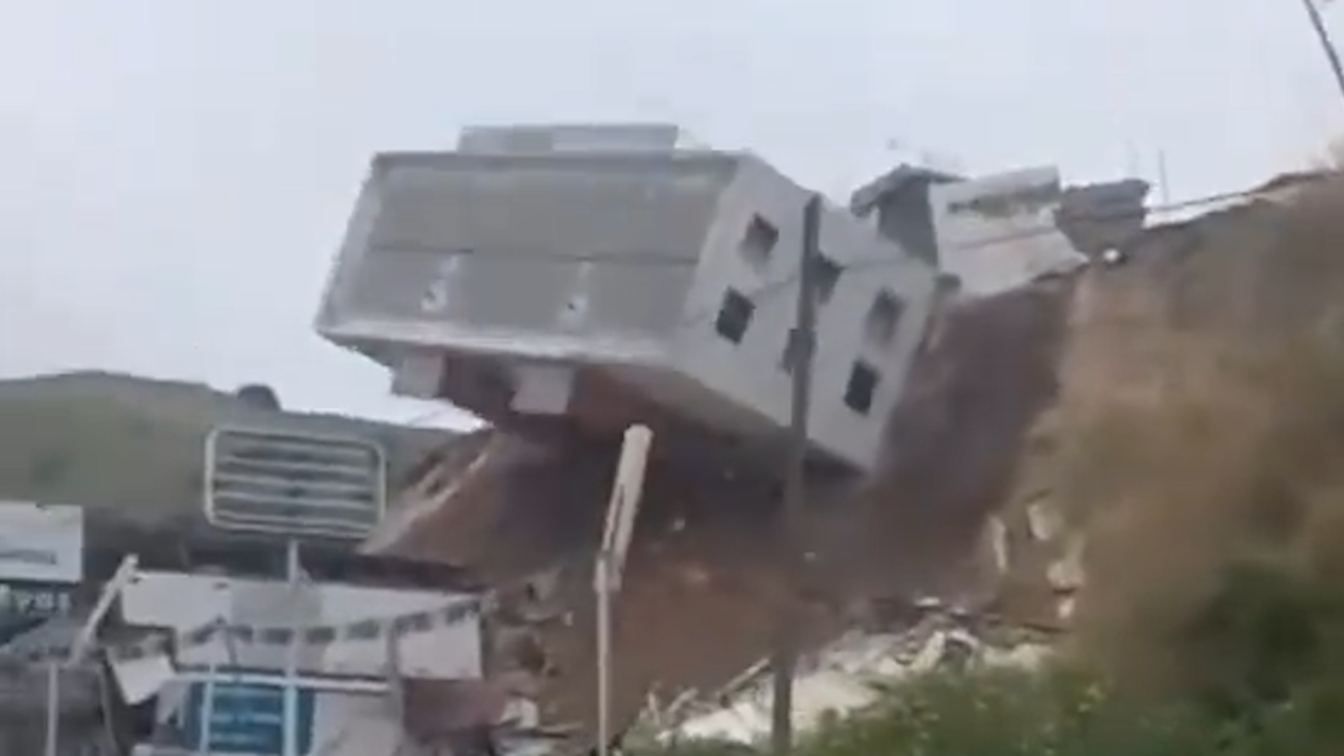 Building Crashes Down Hill After Landslide - Videos from The Weather ...
