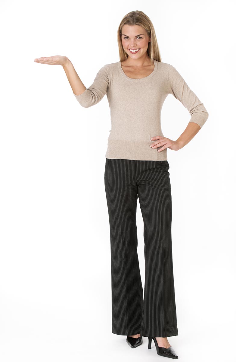A young woman is standing with her arm outstretched while smiling at ...